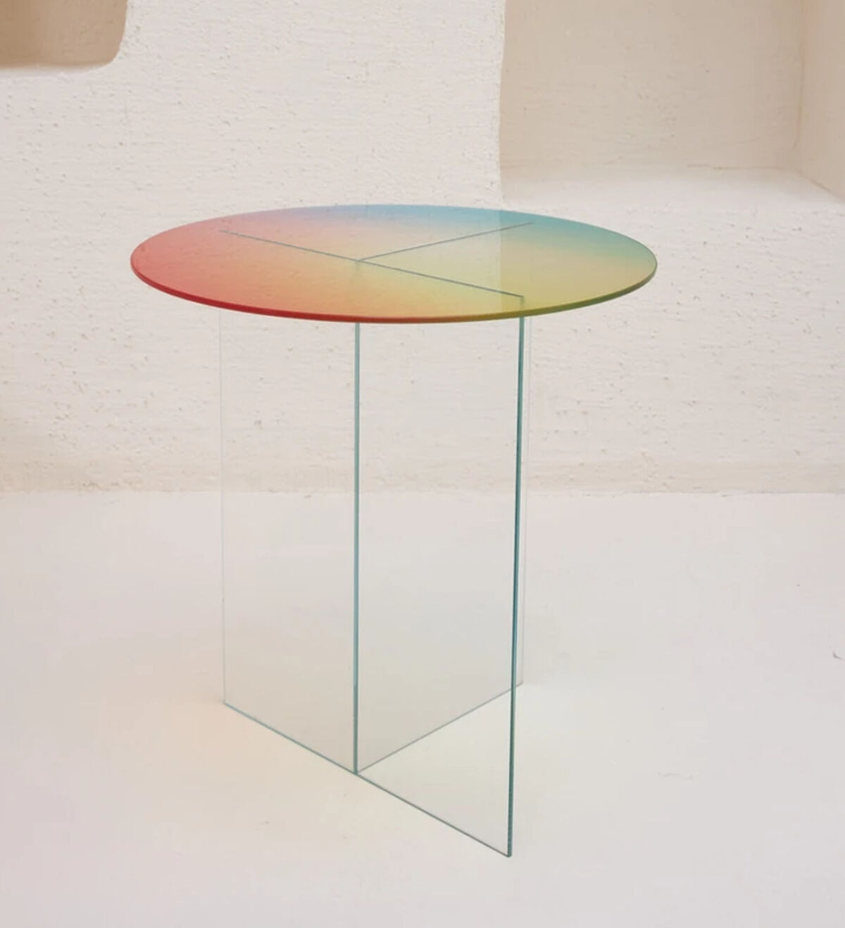 Series of Light and Glass Tables Draw in With Delicate Space Affair