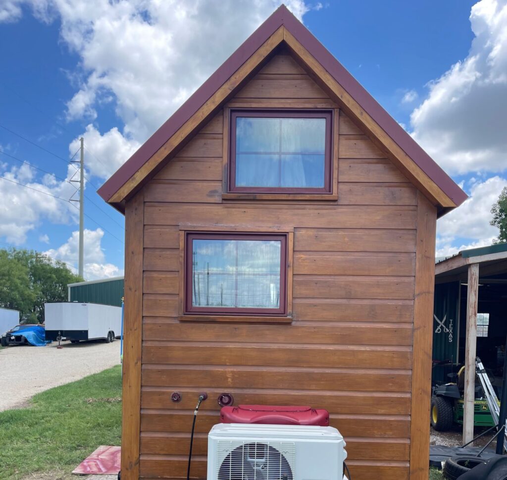 Rustic Red Tiny House has Most Versatile Bay Window, Tiny Porch