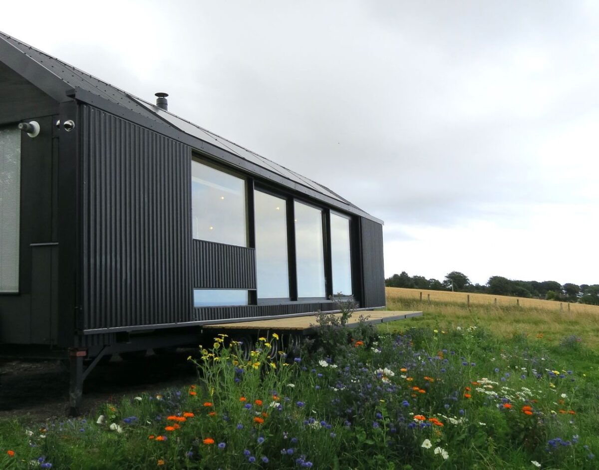 Long Shed Tiny House has Off-Grid Features in Minimalistic Layout