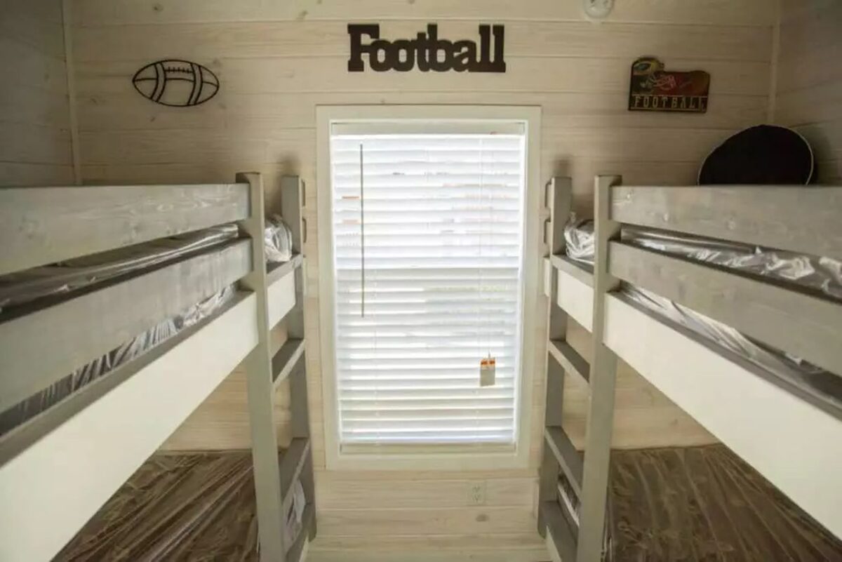 Titus Tiny House has Front Porch, Bunk Beds and Master Bedroom