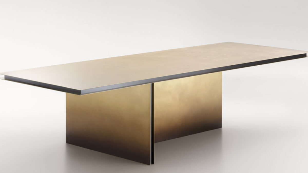 Folio Table With Perpendicular Brass Planes Adds Spice to Bland Space