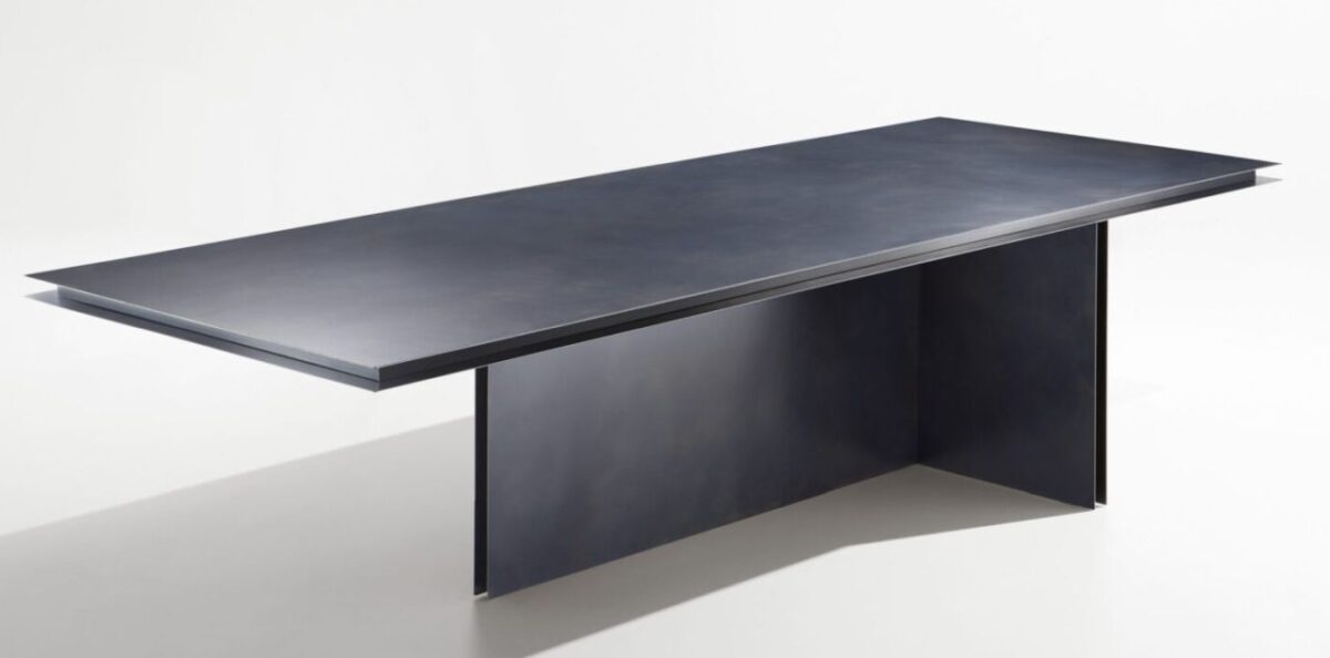 Folio Table With Perpendicular Brass Planes Adds Spice to Bland Space