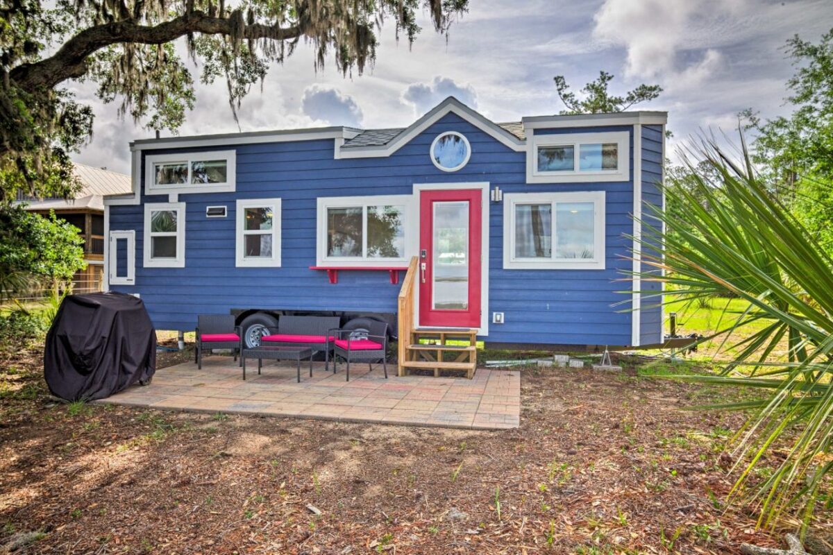 Waterfront Tiny House With Bay Window Offers Twin Lofts
