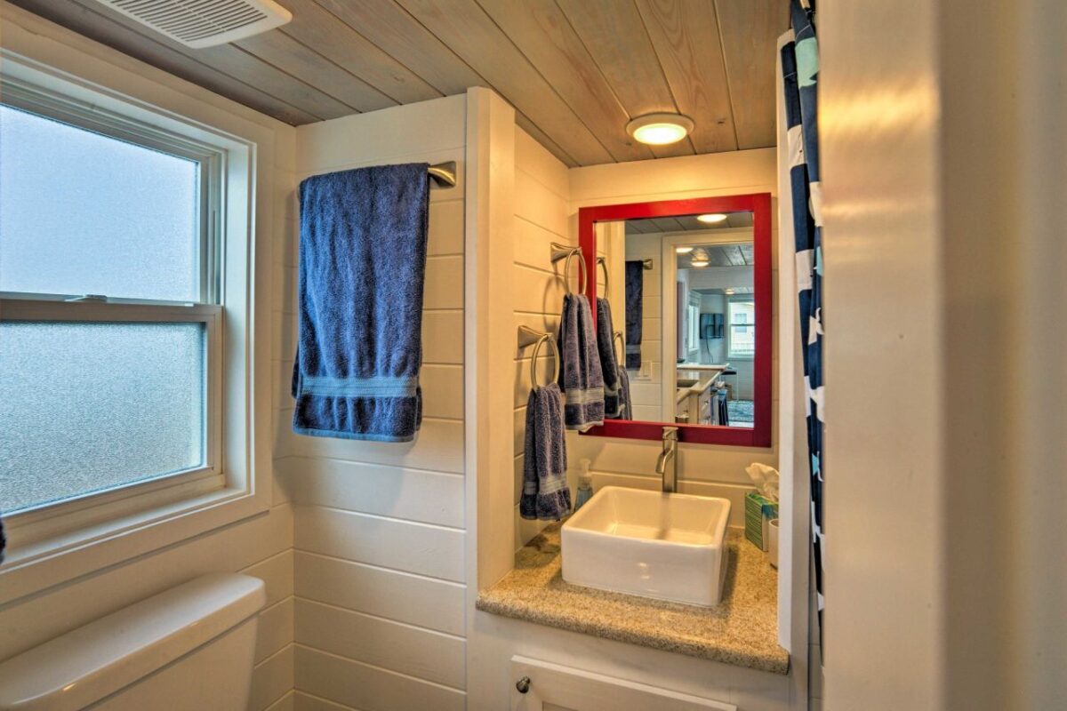 Waterfront Tiny House With Bay Window Offers Twin Lofts