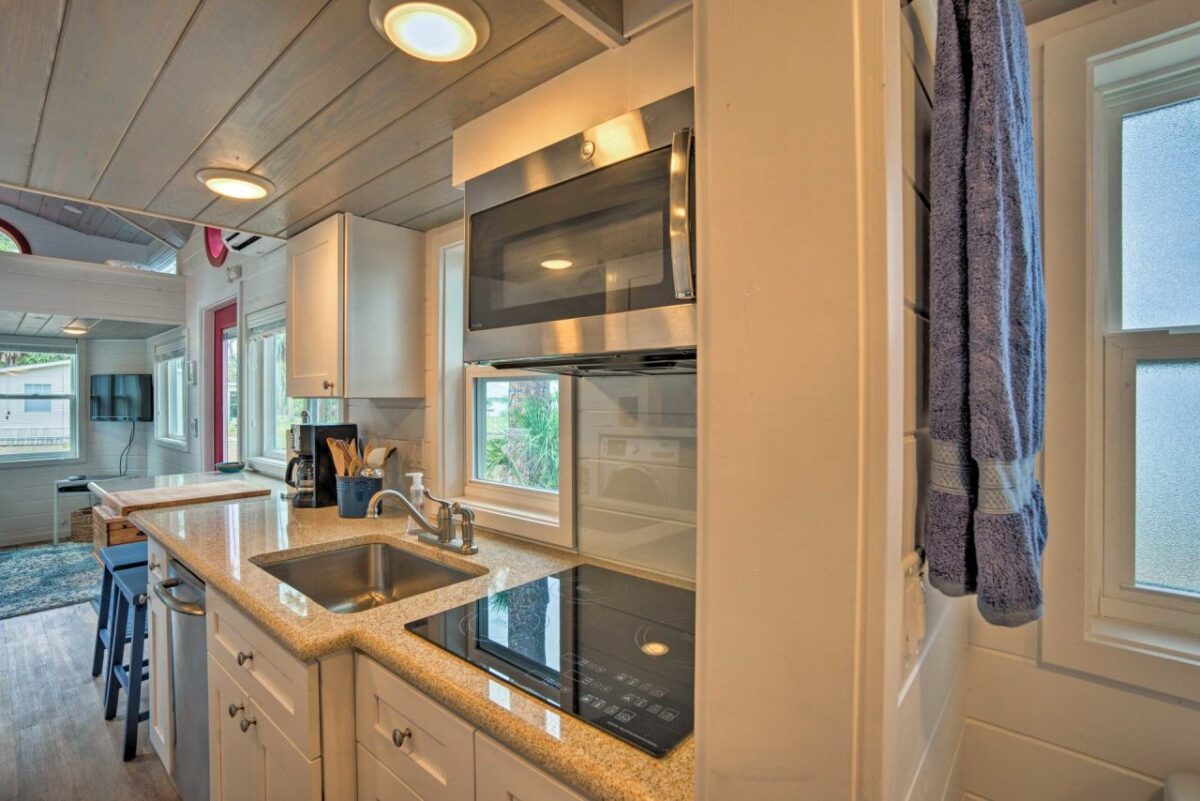 Waterfront Tiny House With Bay Window Offers Twin Lofts