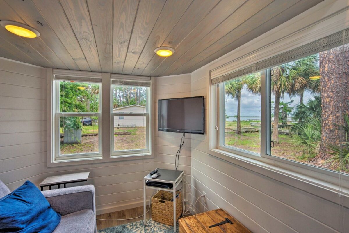 Waterfront Tiny House With Bay Window Offers Twin Lofts