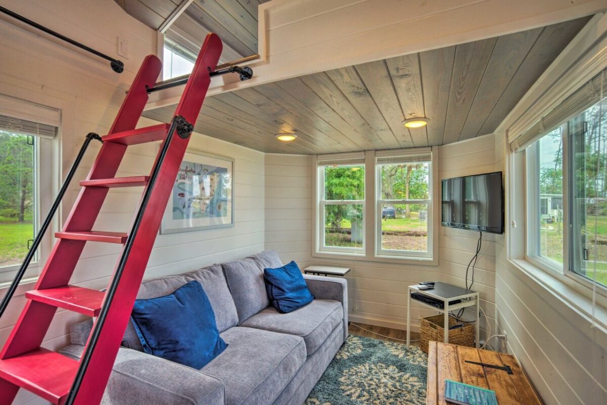 Waterfront Tiny House With Bay Window Offers Twin Lofts