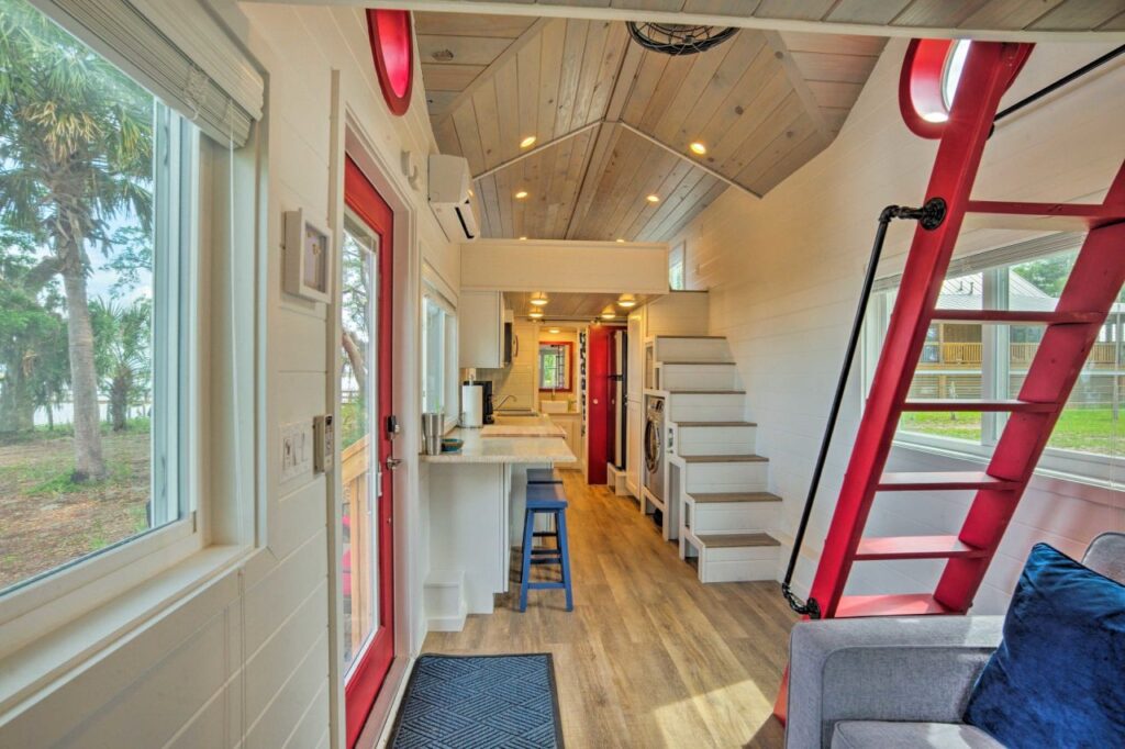 Waterfront Tiny House With Bay Window Offers Twin Lofts