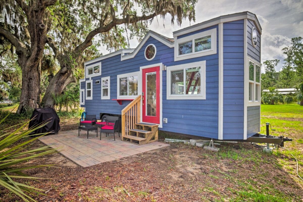 Waterfront Tiny House With Bay Window Offers Twin Lofts