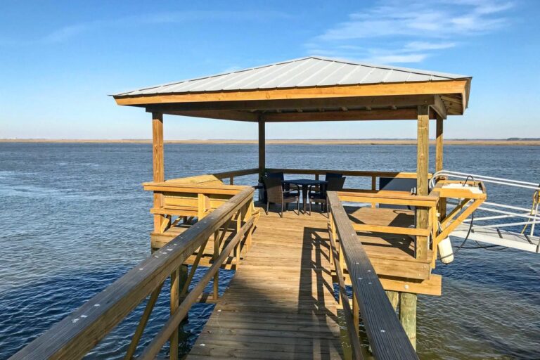 Waterfront Tiny House With Bay Window Offers Twin Lofts