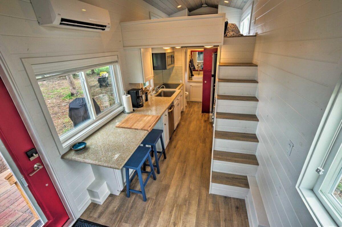 Waterfront Tiny House With Bay Window Offers Twin Lofts