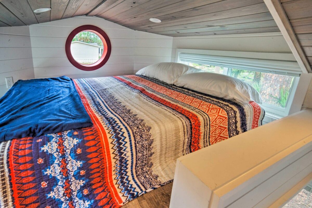 Waterfront Tiny House With Bay Window Offers Twin Lofts