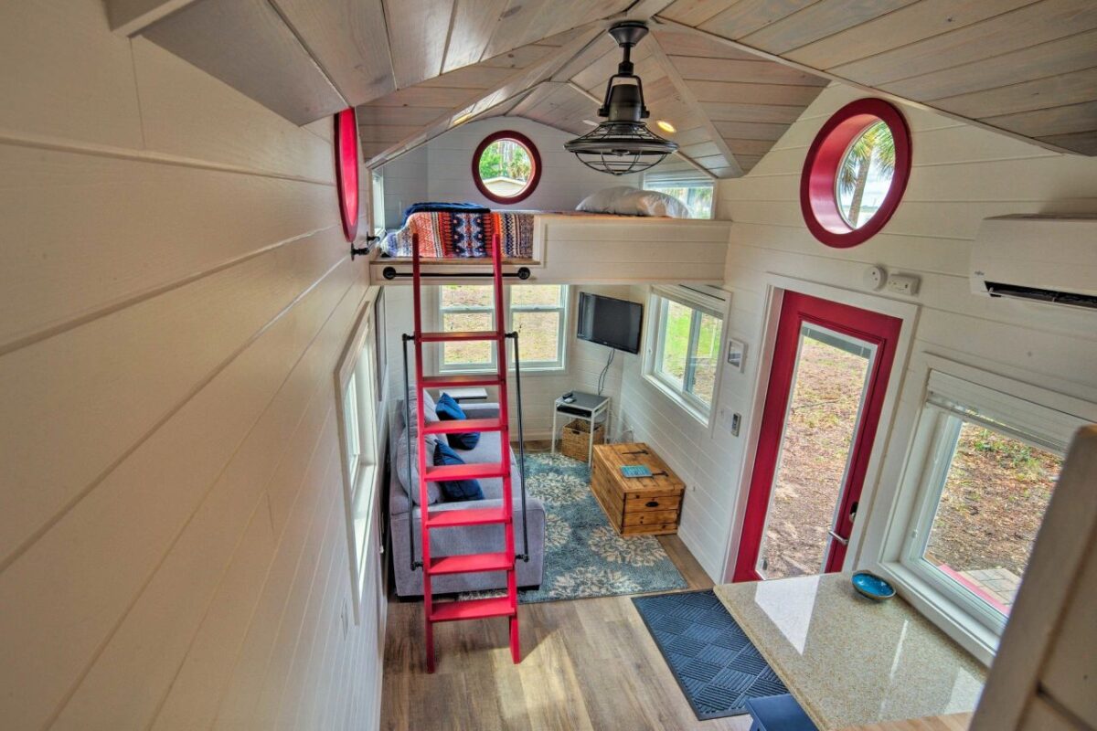 Waterfront Tiny House With Bay Window Offers Twin Lofts