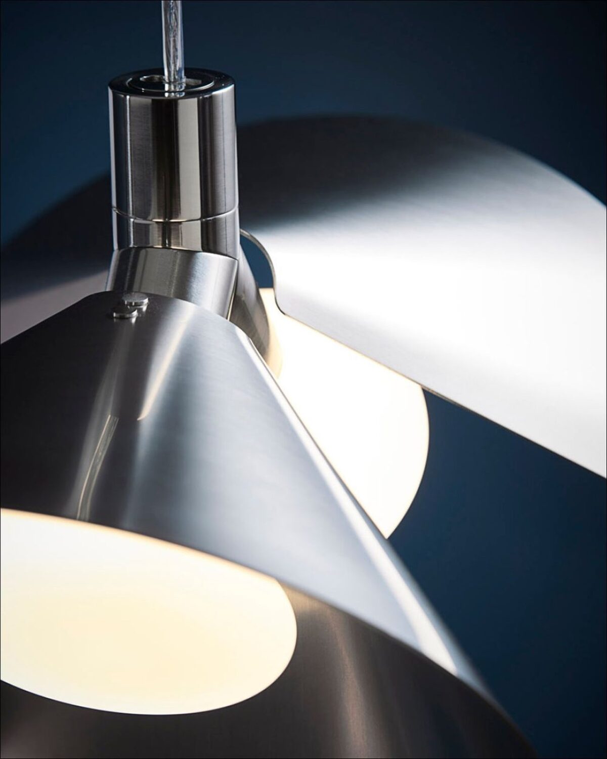 Peel Lamp Bends Single Steel Sheet for Playful Curvaceous Form