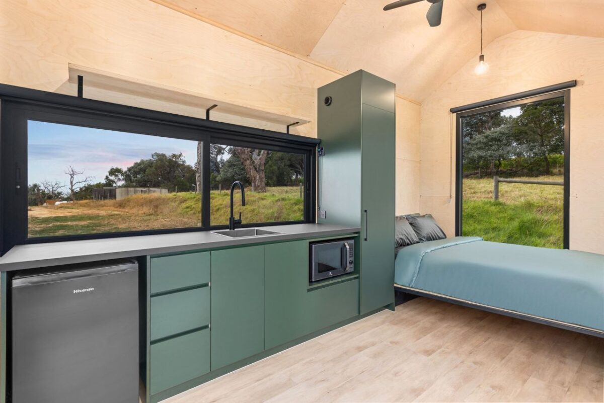 Freedom Tiny House Features Oversized Windows and a Skylight