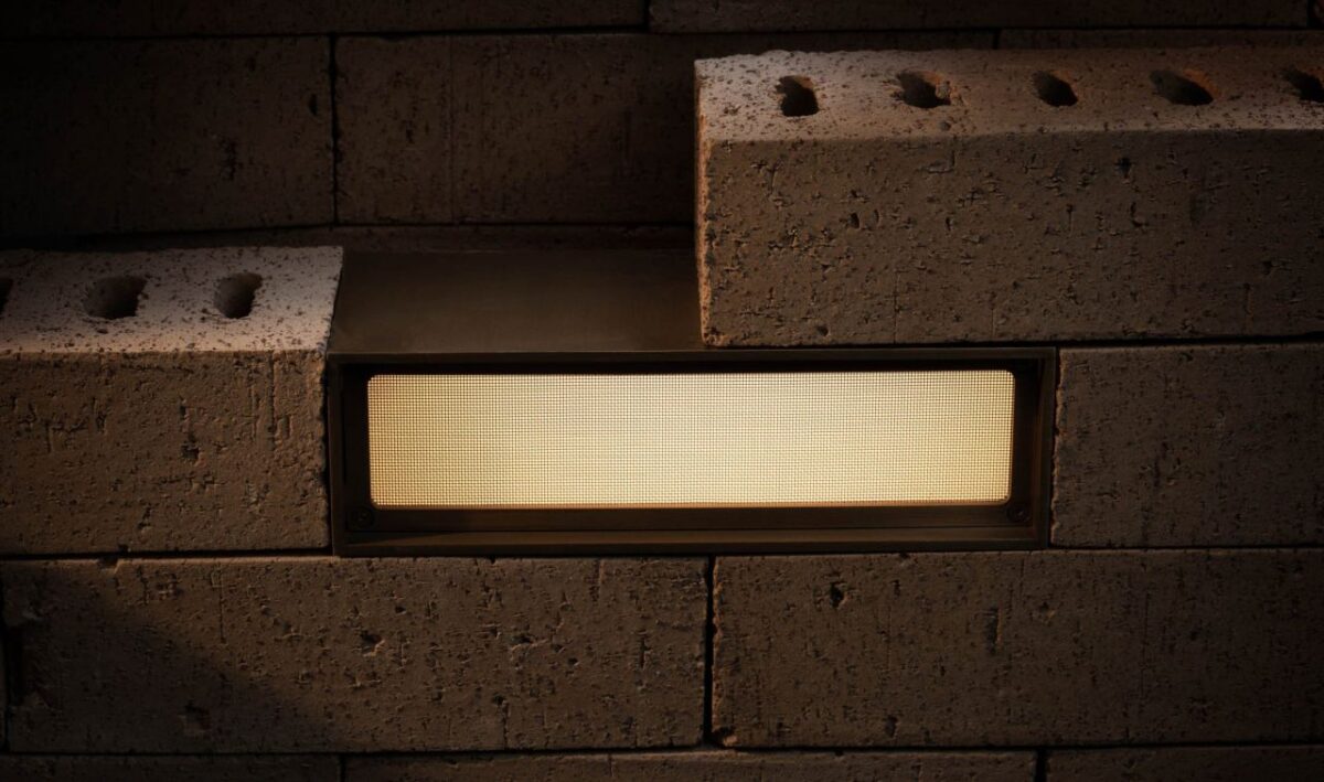 OG Brick Lamp Blends in With the Fabric of Masonry Brick Wall