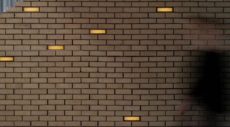 OG Brick Lamp Blends in With the Fabric of Masonry Brick Wall
