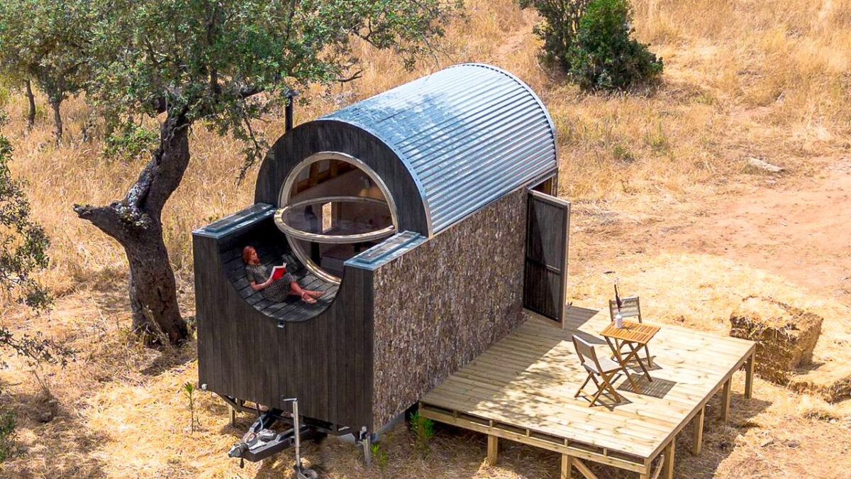 Tiny House has Round Pivot Window to Escape Onto Odd Balcony