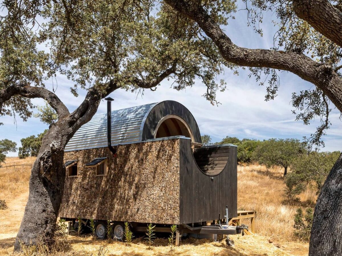 Tiny House has Round Pivot Window to Escape Onto Odd Balcony