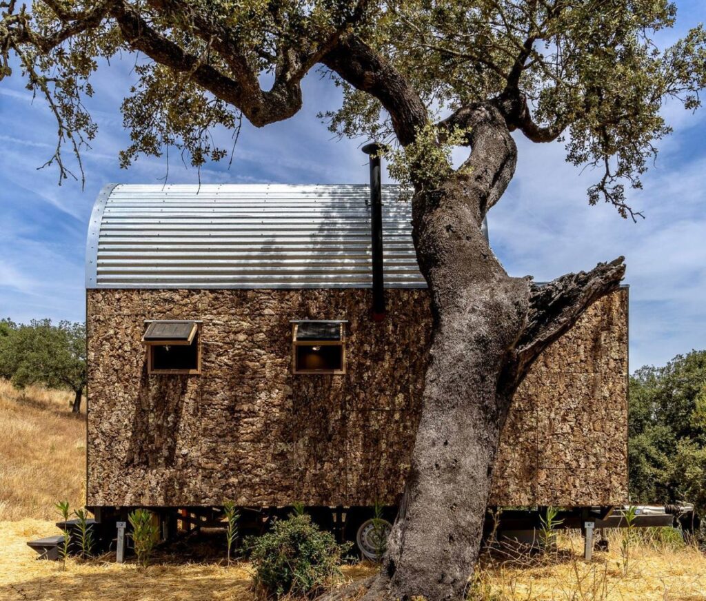 Tiny House has Round Pivot Window to Escape Onto Odd Balcony