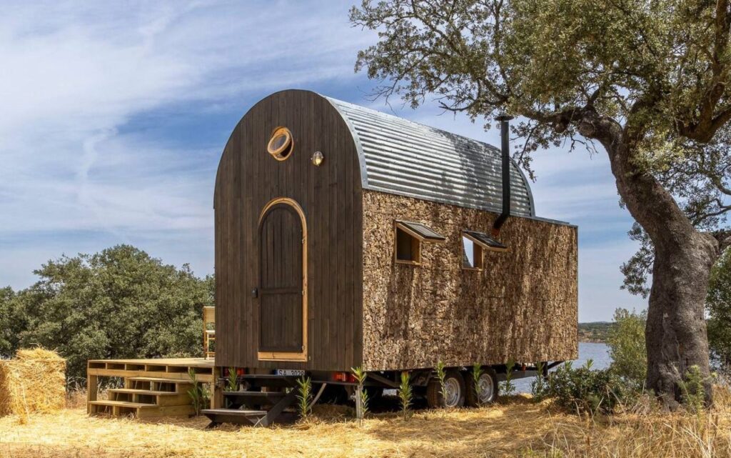 Tiny House has Round Pivot Window to Escape Onto Odd Balcony