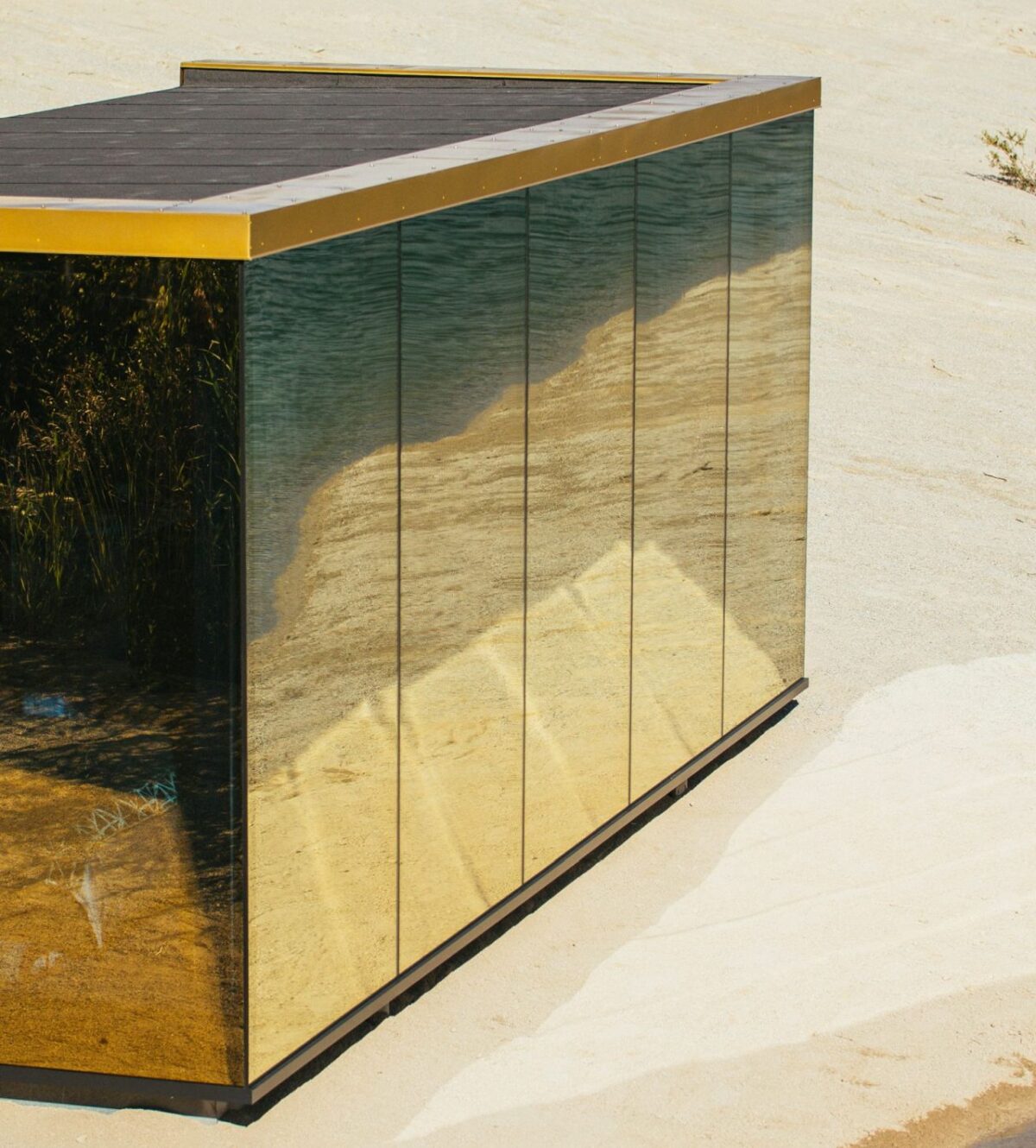 Golden Tiny House has a Glow Changing Shimmering Glass Body