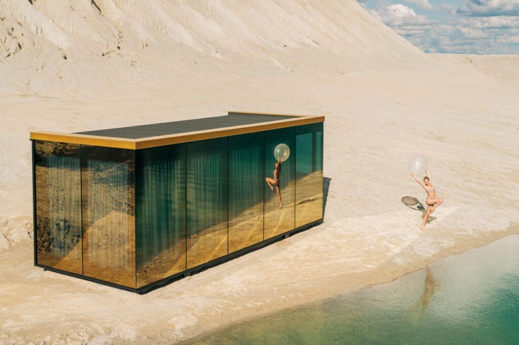 Golden Tiny House has a Glow Changing Shimmering Glass Body