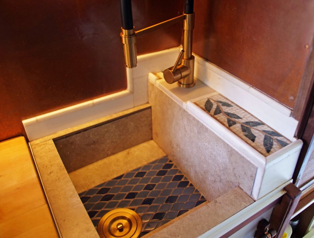 Hobbit Camper Van has Murphy bed and Medieval Shower