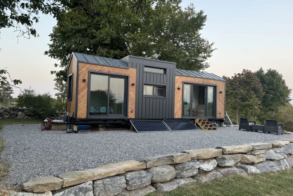 Steel Frame Tiny House has Downstairs Bedroom, Versatile Loft