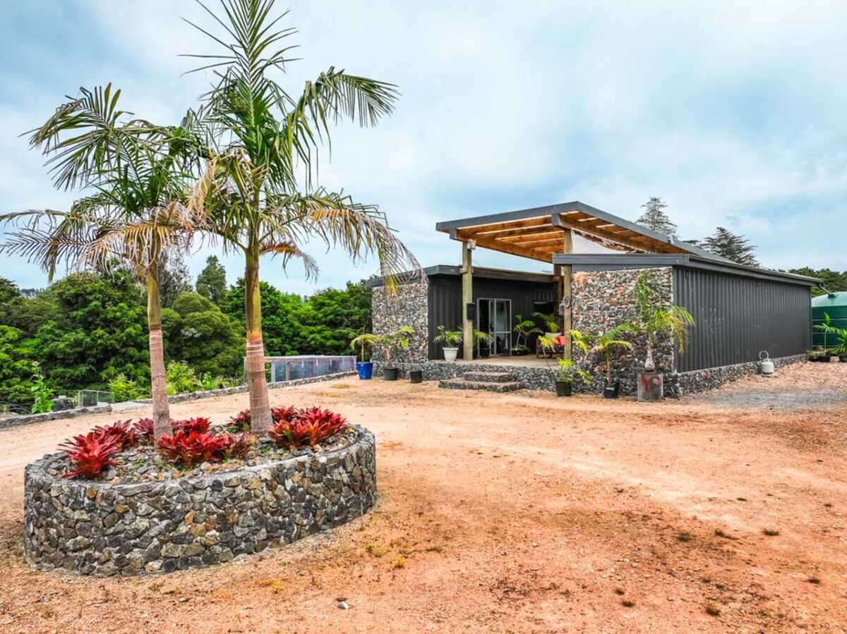 Man Converts Shipping Containers Into Off-Grid Haven With Atrium