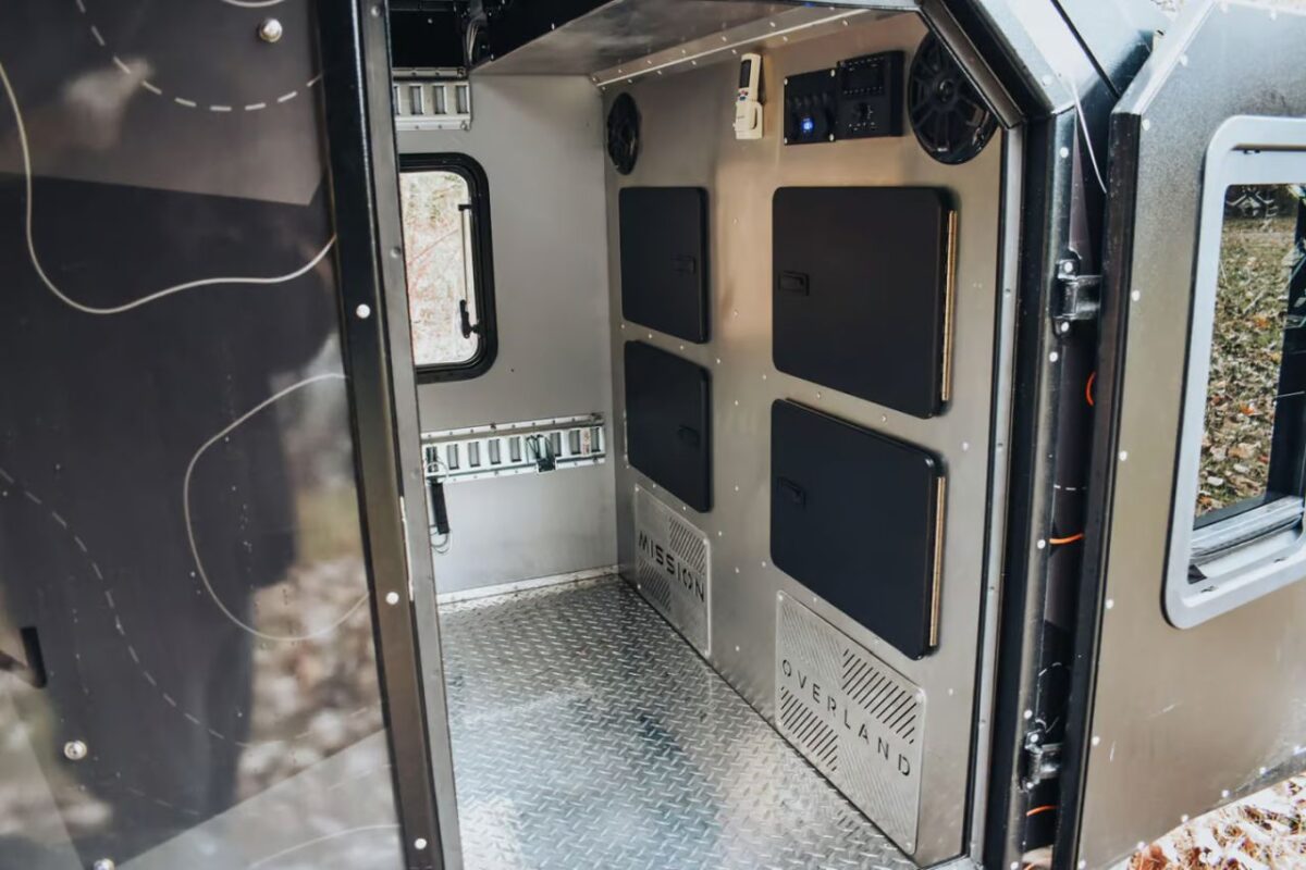 Trail Dog Two-Level Toy Hauler is Mobile Home With Pop-Up Roof
