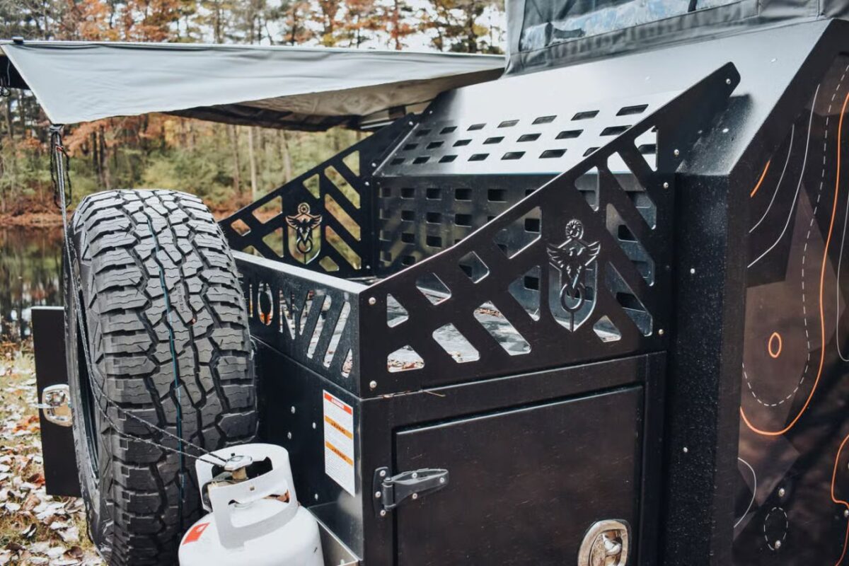 Trail Dog Two-Level Toy Hauler is Mobile Home With Pop-Up Roof