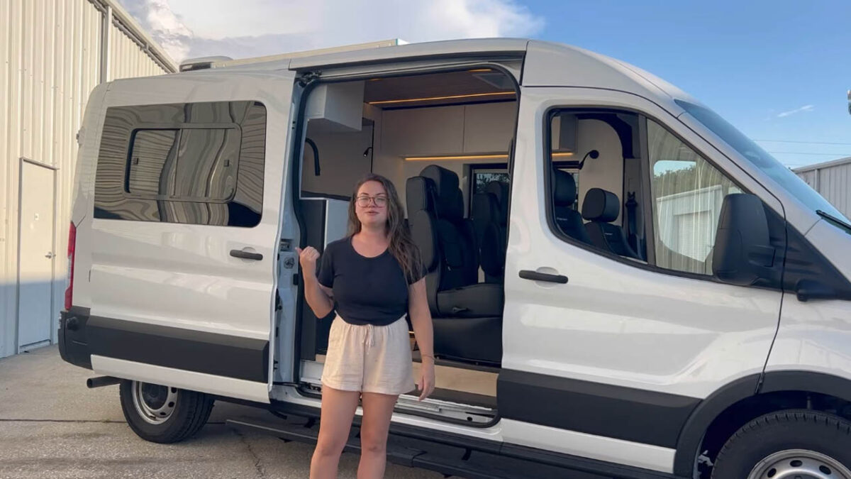 Camper Van Conversion has Ceiling Bed and Room for Three Dogs