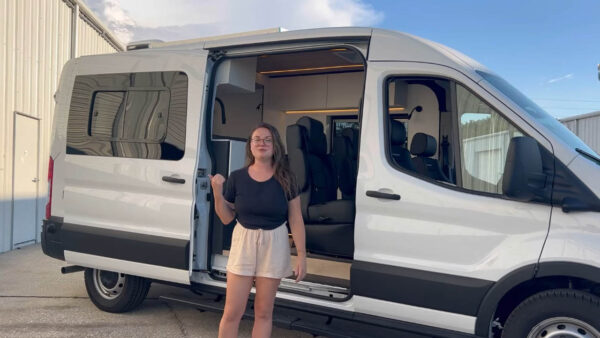 Camper Van Conversion has Ceiling Bed and Room for Three Dogs